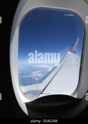 View through the window of a Boeing 737 aircraft. Across the apron a ...