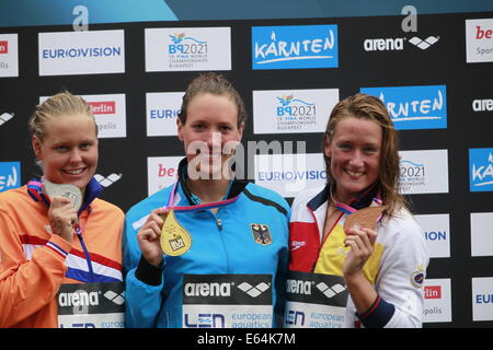 Germany's Isabelle Harle (C) during the awarding of the women's 5km ...