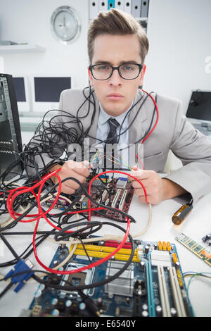Portrait of a Thoughtful Engineer Working on Desktop Computer in a ...