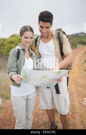 female explorer looking at a map outdoors Stock Photo - Alamy
