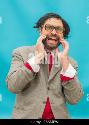 Scared man screaming and looking startled at something, standing ...