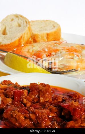 Tapas selection cod in Biscay sauce, red peppers stuffed with cod and ...