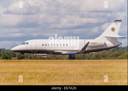 A plane Dassault Falcon 2000EX (G-WWFC) taking off from Luton Airport ...