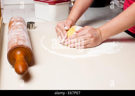 Baker making cookies in kitchen Stock Photo - Alamy