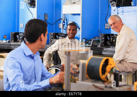 close up of instructor setting up wireless microphone before workout ...