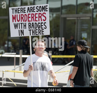 LAPD officers stand in front of Slauson Donuts at 3420 W Slauson Ave F ...