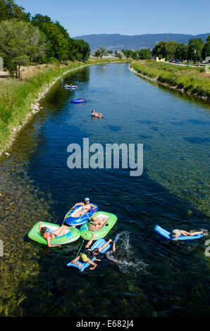 Inner tubing rafting floating on the Penticton River, Penticton, BC ...