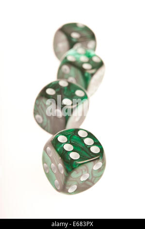 Dice in a row isolated on a beige background Stock Photo - Alamy