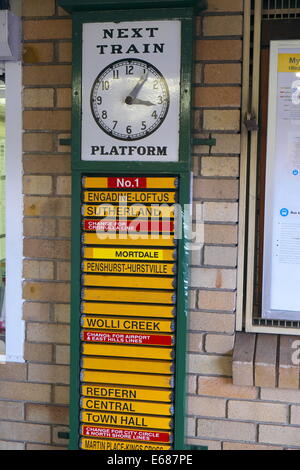 traditional timber railway timetable board at heathcote railway station ...