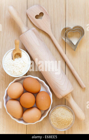 Utensils for baking and bowl of sugar on light background, closeup ...