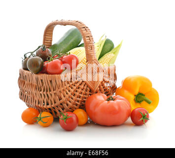 Farmer with wicker basket of vegetables on orange background Stock ...