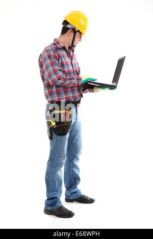 construction worker using laptop computer while showing house design ...
