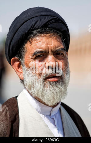 Iran, Isfahan, portrait of an Iranian man working in a barber shop ...
