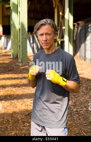 Portrait of Caucasian boxer with fists raised Stock Photo - Alamy