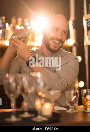 Latin bartender mixing a drink in an impressive way. Cocktail skills of ...