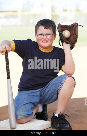 Baseball in mitt with bat on grass field with piles of one hundred ...