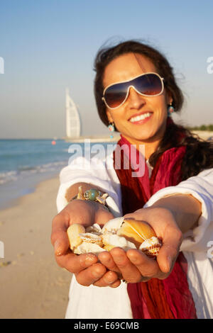 Seashells by the Burj Al Arab on the shores of the Persian Gulf in ...