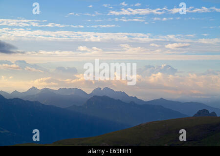 Overlapping mountain ridges in several shades of blue at sunrise Stock ...