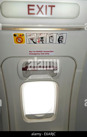 Windows of airplane with emergency exit door Stock Photo: 122755536 - Alamy