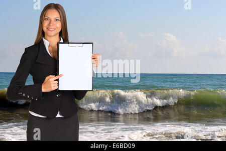 Businesswoman holding paper holder. Empty circle frames and world map ...