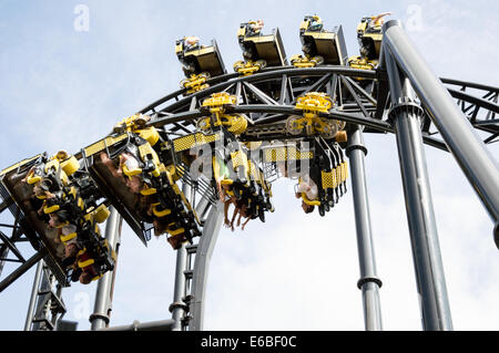 The Smiler at Alton Towers Theme park, UK. Yellow cars fly round the ...