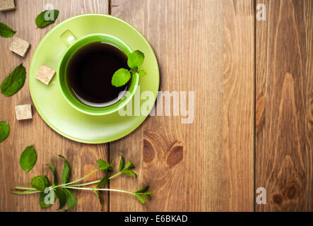 Mint leaves, brown sugar and cup of mint tea Stock Photo - Alamy