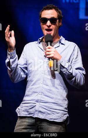 Marcus Ryan, Australian born stand-up comedian, sitting in the lap of ...