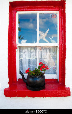 A traditional Irish cottage sash window at Bunratty, Co Clare, Rep of ...