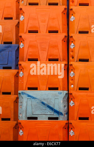 Abstract image of orange fish containers at a fish packing factory in ...