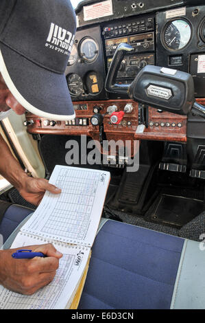 Pilot performs preflight checklist Stock Photo - Alamy