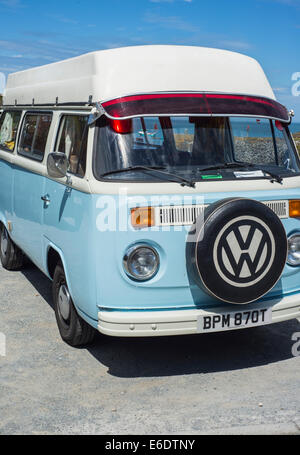 A restored blue Volkswagen VW Type 2 Bay Window Camper Van at a vintage ...