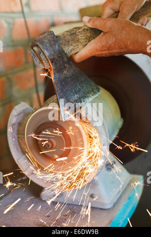Sharpening an axe Stock Photo - Alamy