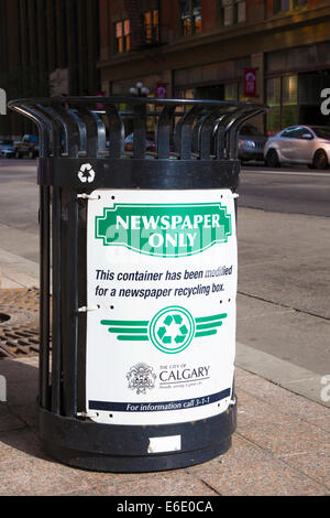 Trash and newspaper recycling containers Stock Photo - Alamy