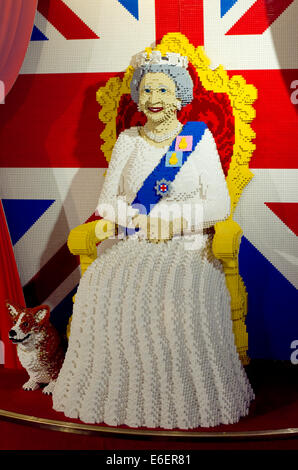 A LEGO model of Queen Elizabeth II (2nd right) inside part of a scale ...