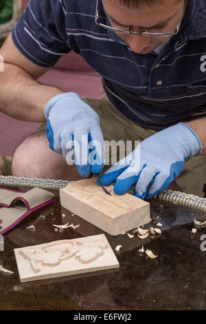 Young man in woodworking hobby concept Stock Photo - Alamy
