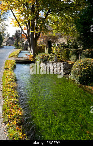 The main street and Teffont Brook in the village of Teffont Magna ...