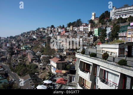 A hillside of slums in Shimla, Himachal Pradesh, India. At the top of ...