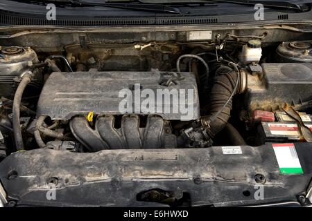 Old dirty engine under the hood of a car close-up Stock Photo - Alamy