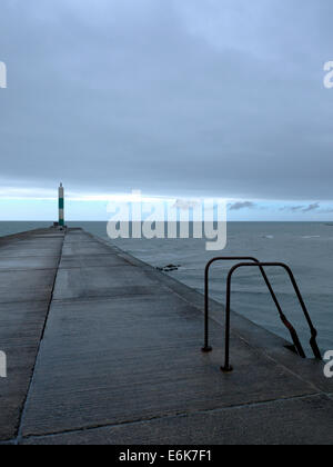 Stone jetty with beacon in Aberystwyth Ceredigion Wales UK Stock Photo ...