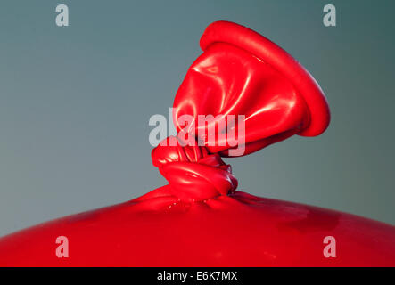Knot of red balloon Stock Photo - Alamy
