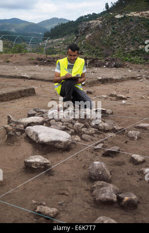 Archaeologist taking notes at an excavation Stock Photo - Alamy