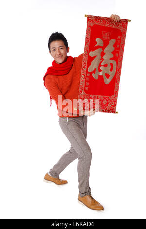 Young man celebrating Chinese New Year Stock Photo - Alamy