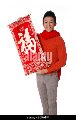 Young man celebrating Chinese New Year Stock Photo - Alamy