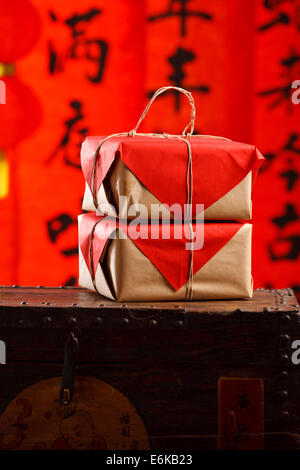 Two classical gift boxes on black background Stock Photo - Alamy