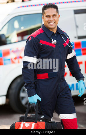 happy Indian paramedic carrying portable medical equipments Stock Photo ...