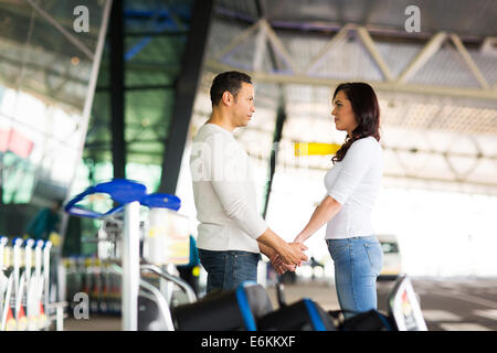 sad young couple say goodbye at airport Stock Photo - Alamy