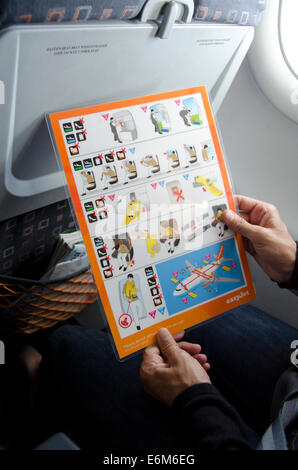 Aircraft passenger safety information card with emergency instructions ...