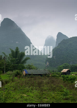 Farm shacks in dramatic limestone peaks, Guilling countryside, China ...