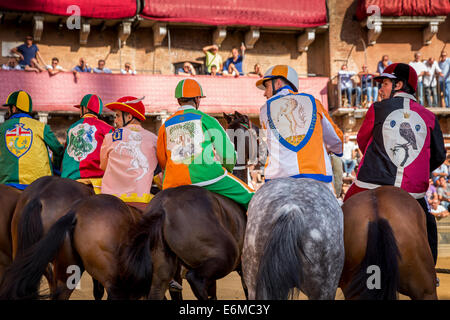 Jockeys waiting for the start of Palio di Siena horse race on Piazza ...