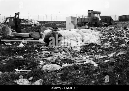 mounds of garbage at a landfill site in the 1990s which is now buried ...